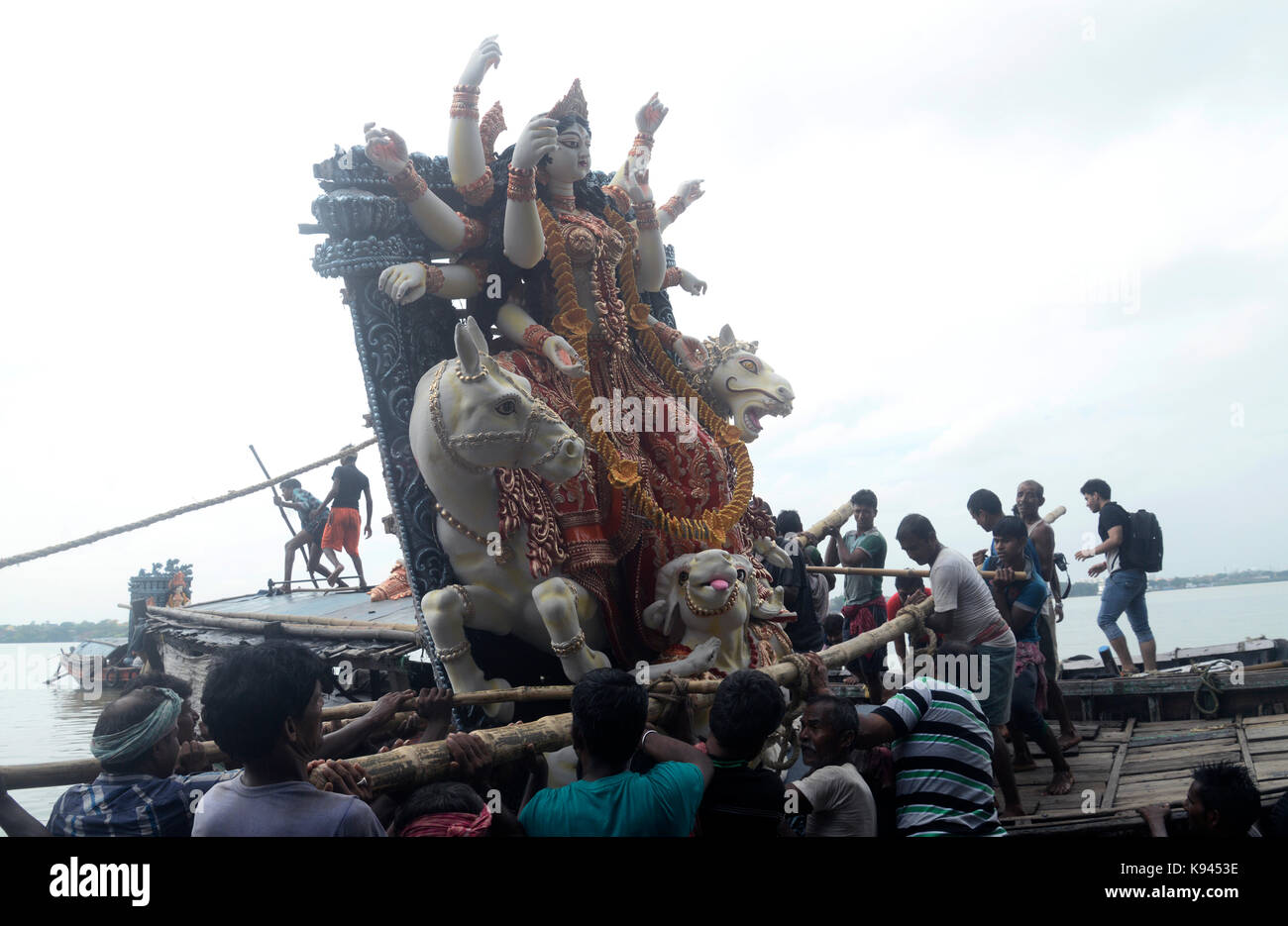 Kolkata, India. 21st Sep, 2017. Laborers carry Durga Idols to load it ...