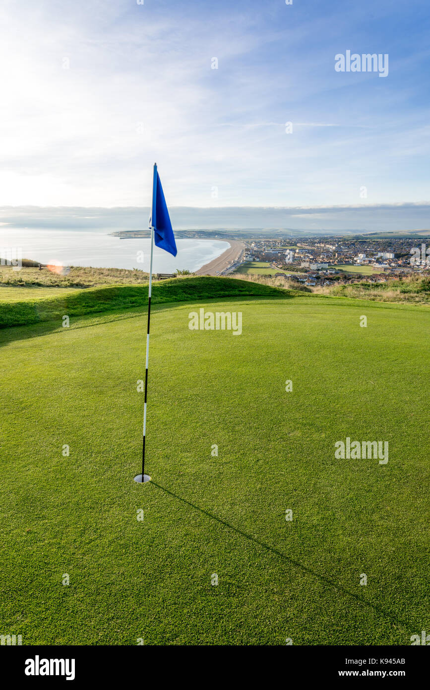 Golf course above beach with seaside view Stock Photo - Alamy