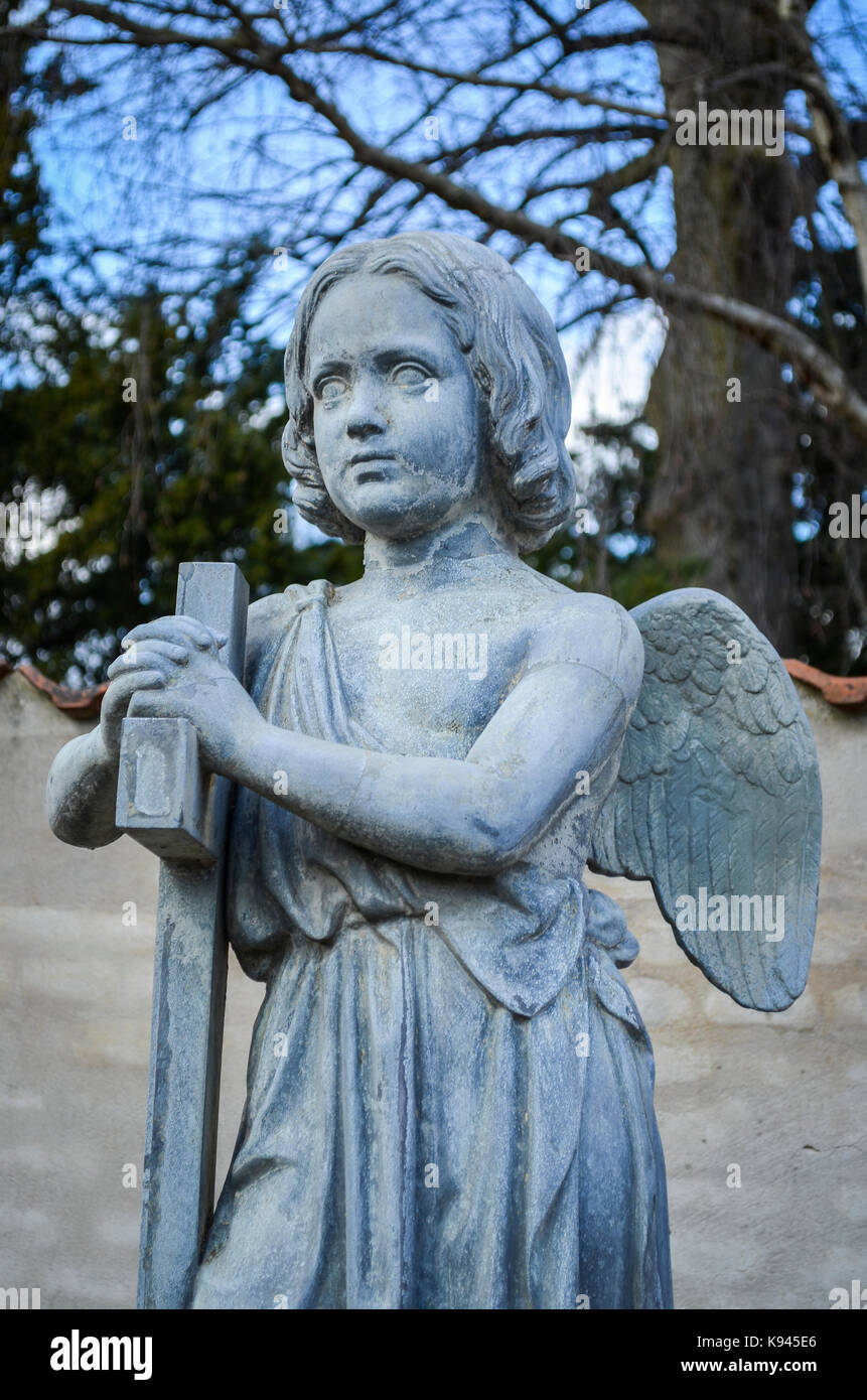 Stone sculpture of angel holding cross in Copenhagen, Denmark Stock ...