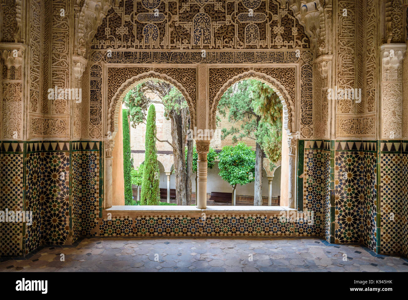 Interior view with double window and tiled walls, Alhambra palace ...