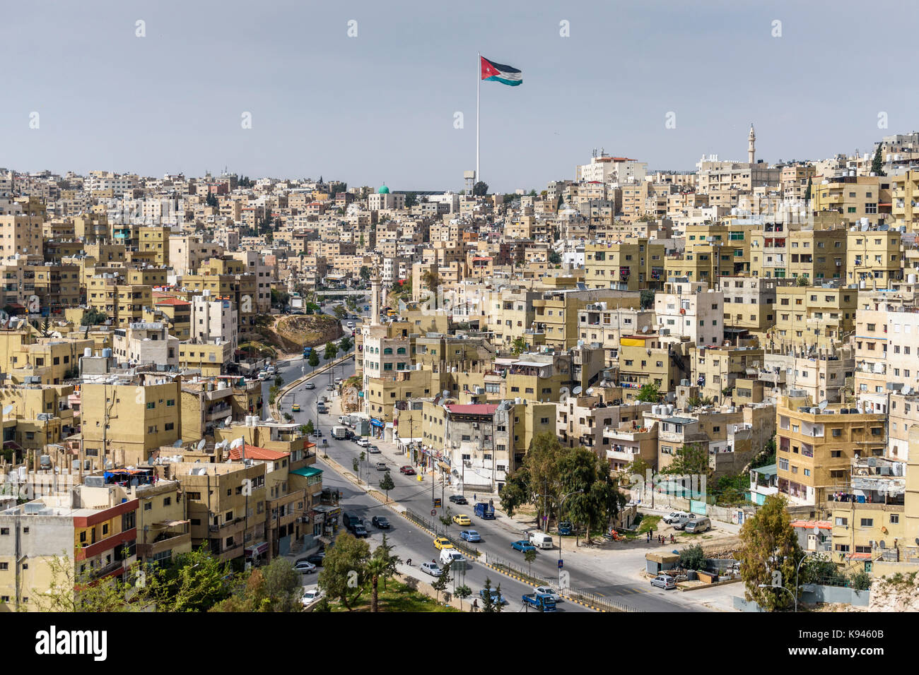 Cityscape of Jerash in the North of Jordan, with Jordanian flag flying ...