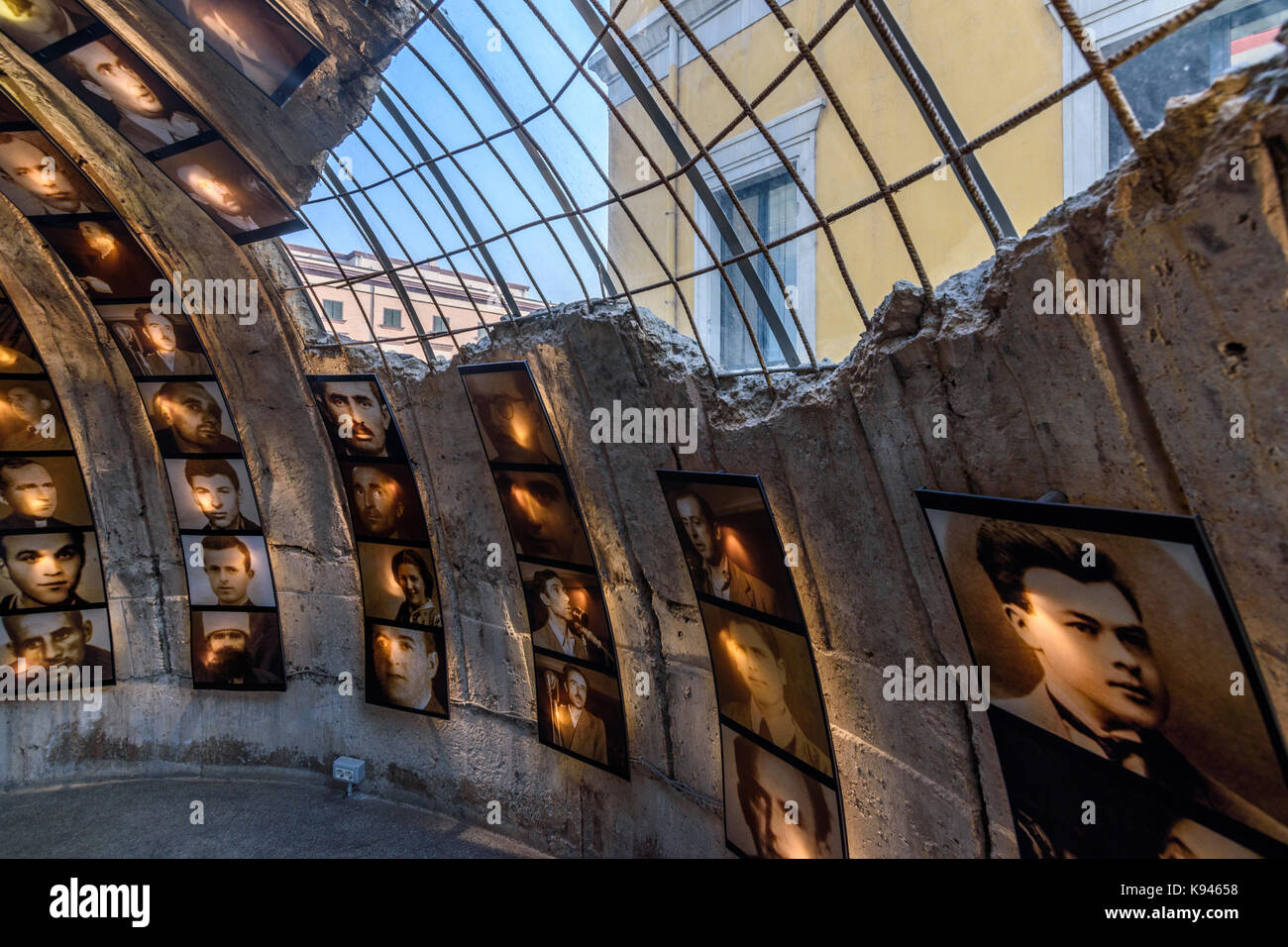 Portraits of men displayed on the inside of a dome, bomb damage ...
