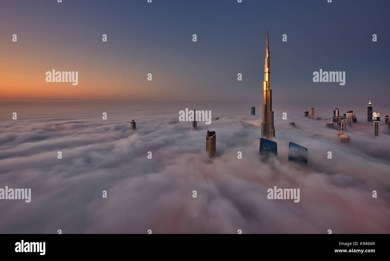 View of the Burj Khalifa and other skyscrapers above the clouds in ...