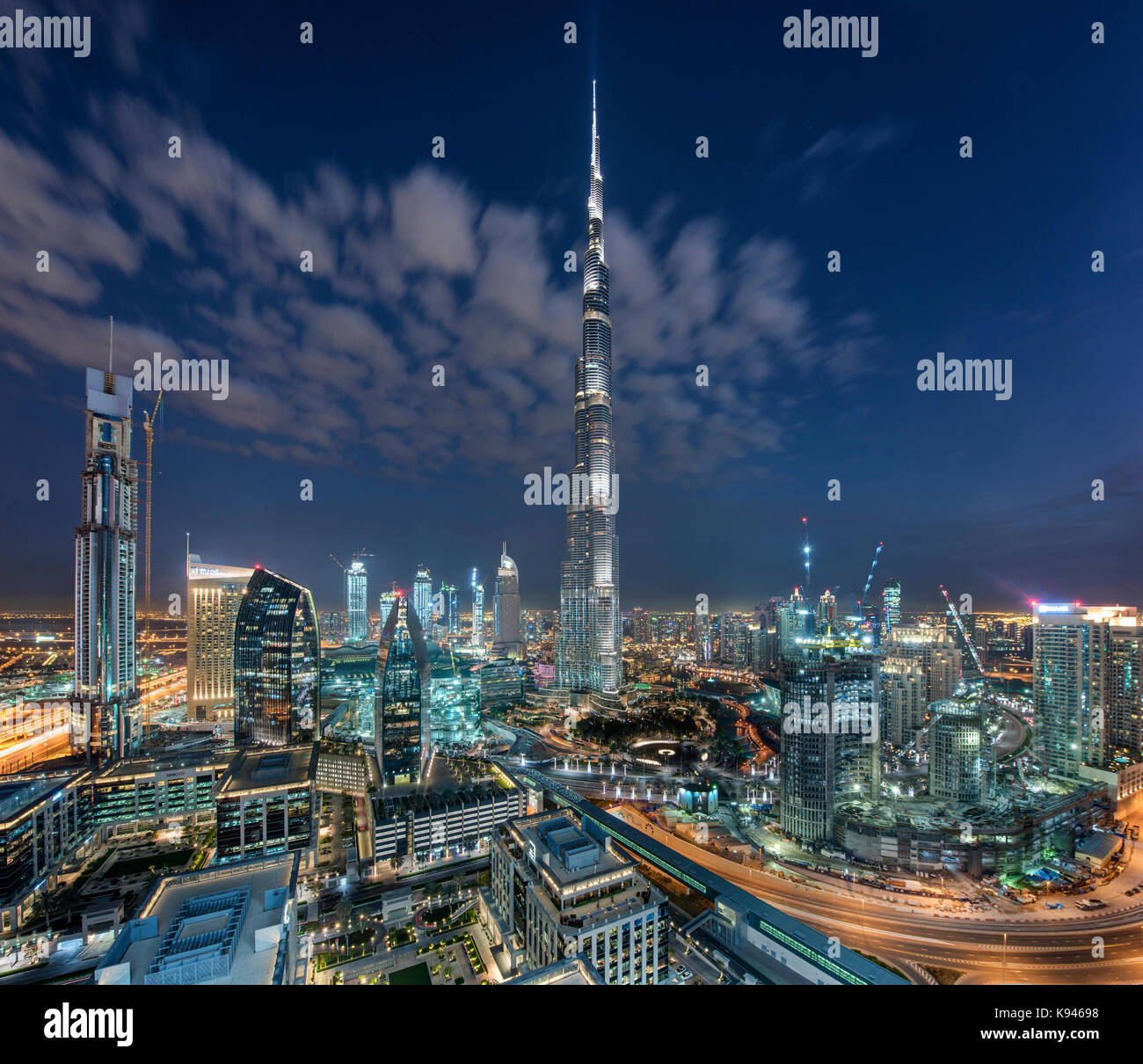 Cityscape of Dubai, United Arab Emirates at dusk, with the Burj Khalifa ...