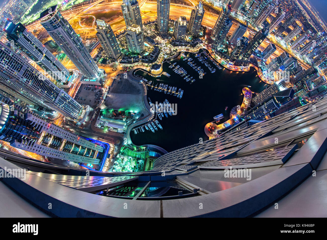 Aerial fish-eye view of Dubai, United Arab Emirates at night, with ...