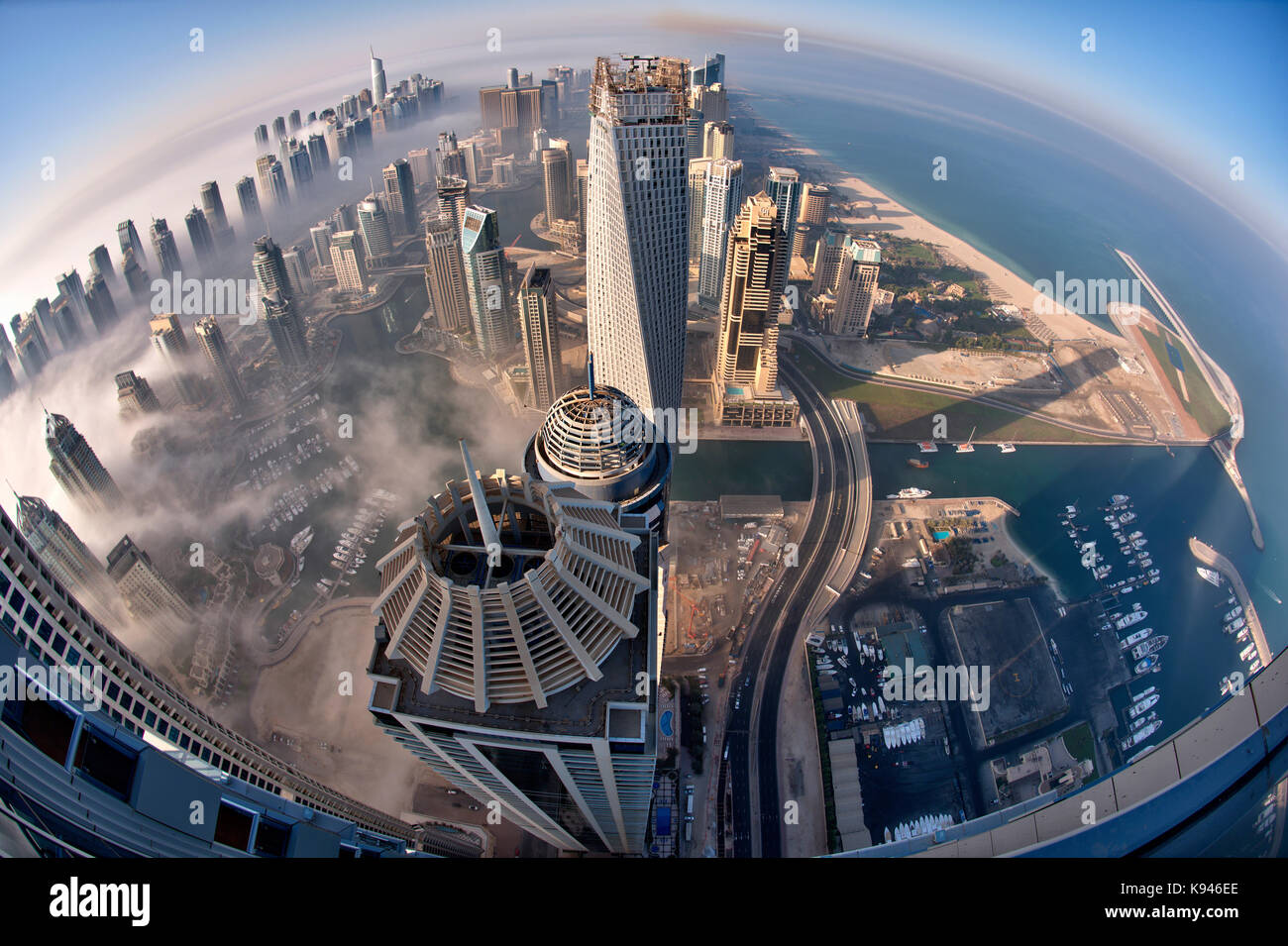 Aerial view of cityscape with skyscrapers above the clouds in Dubai ...