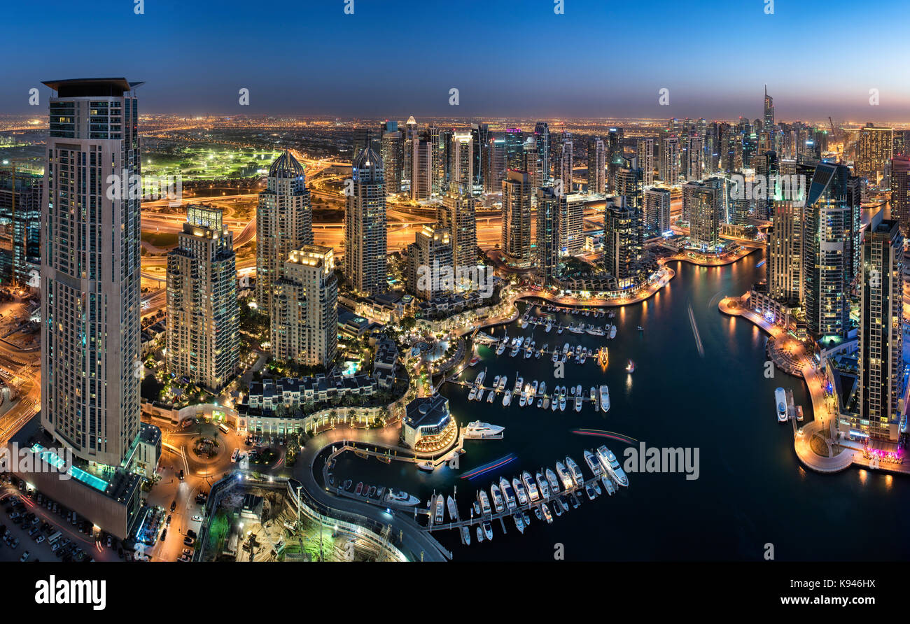 Aerial view of the cityscape of Dubai, United Arab Emirates at dusk ...