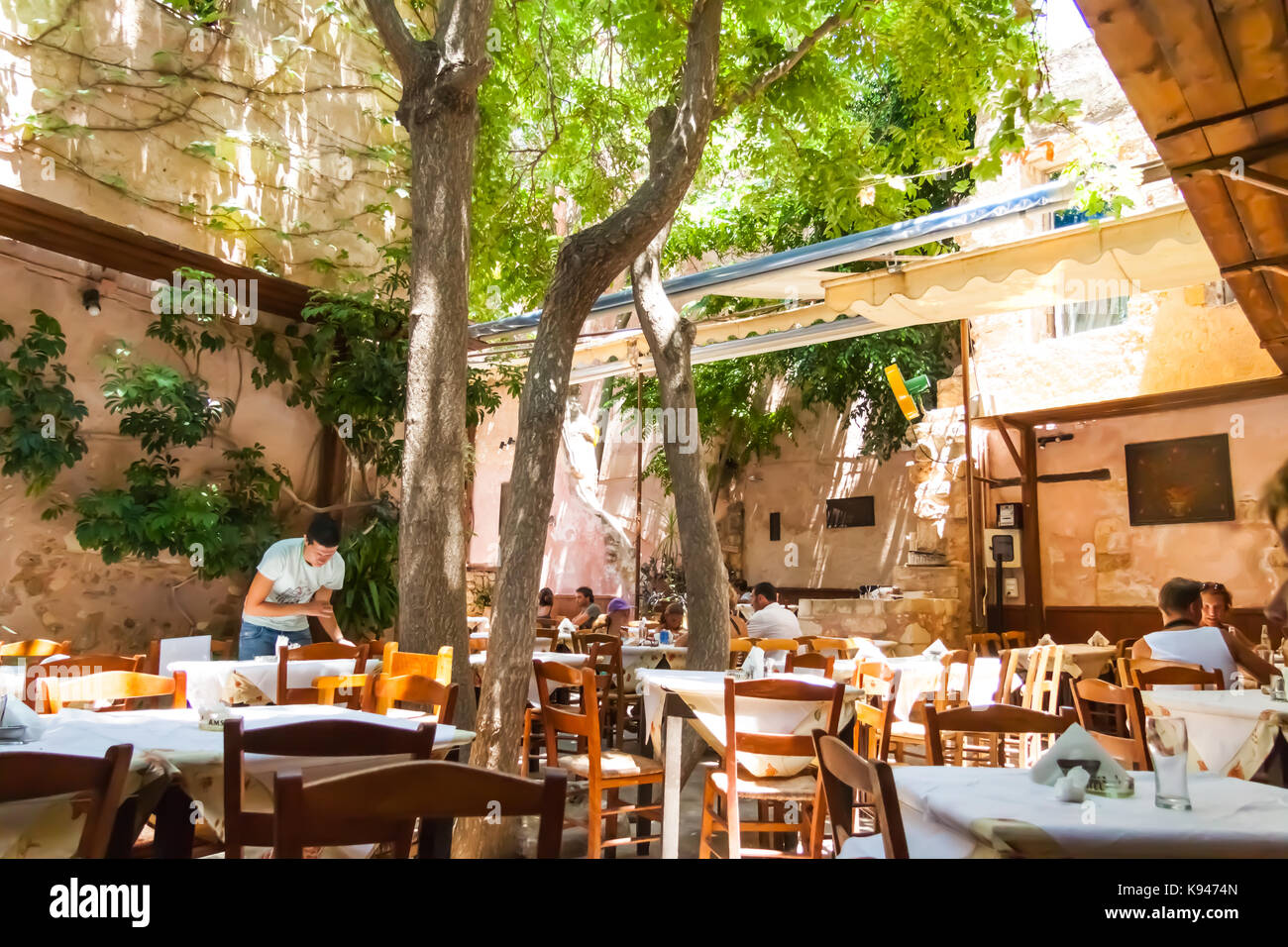 Tourists having lunch in one of the restaurants in the old town of ...