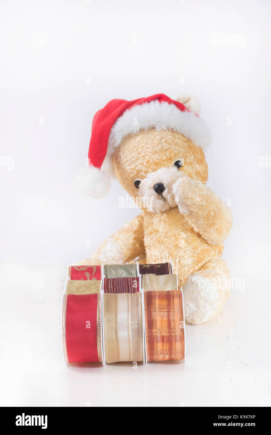 Yellow teddy bear red ribbon hi-res stock photography and images - Alamy