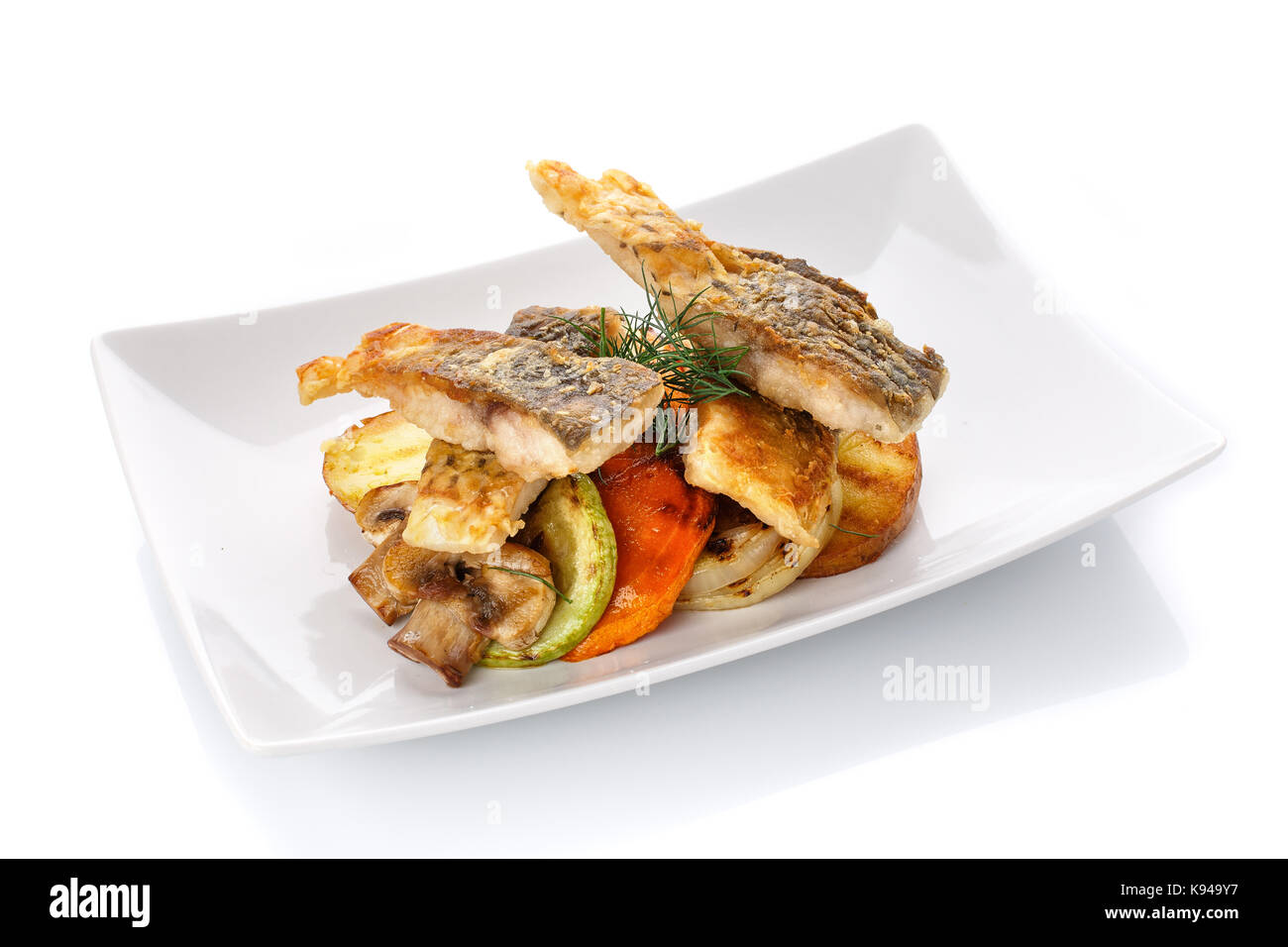 Fried cod fish salad Cut Out Stock Images & Pictures - Alamy