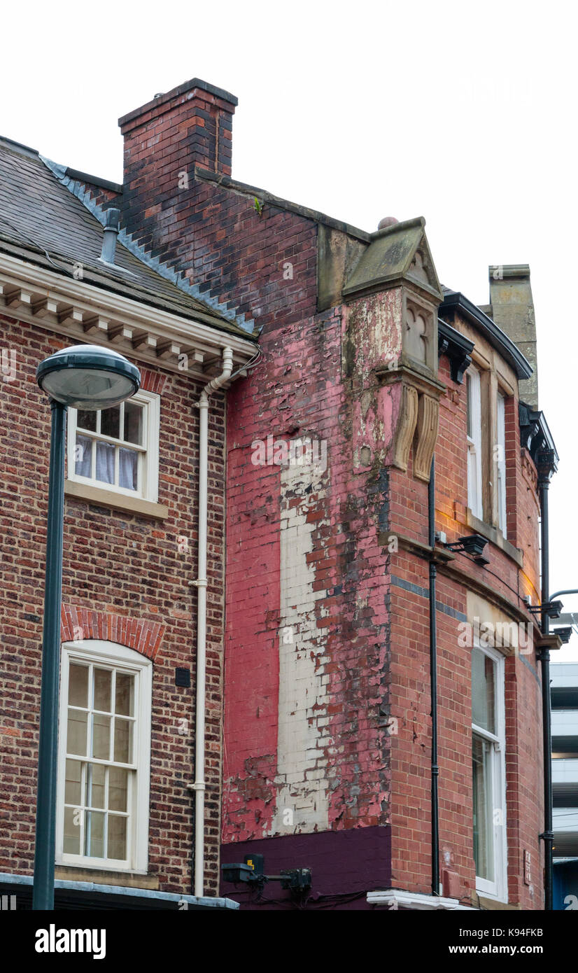 Old, weathered paint work advertising on the side of a building, Mill ...