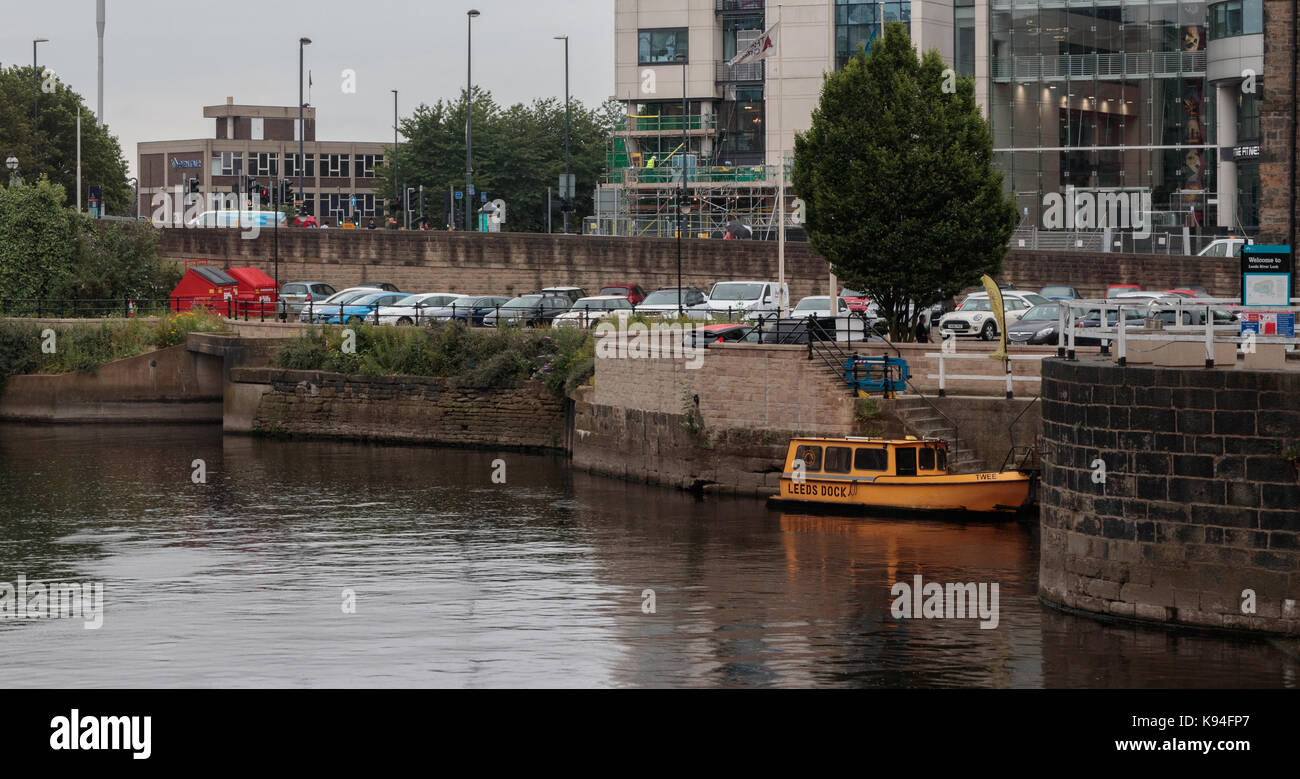 Water taxi moored where the River Aire meets the Leeds Liverpool canal ...