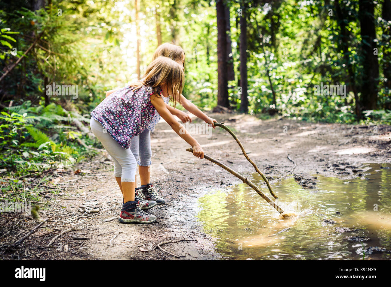 Children playing with sticks hi-res stock photography and images - Alamy