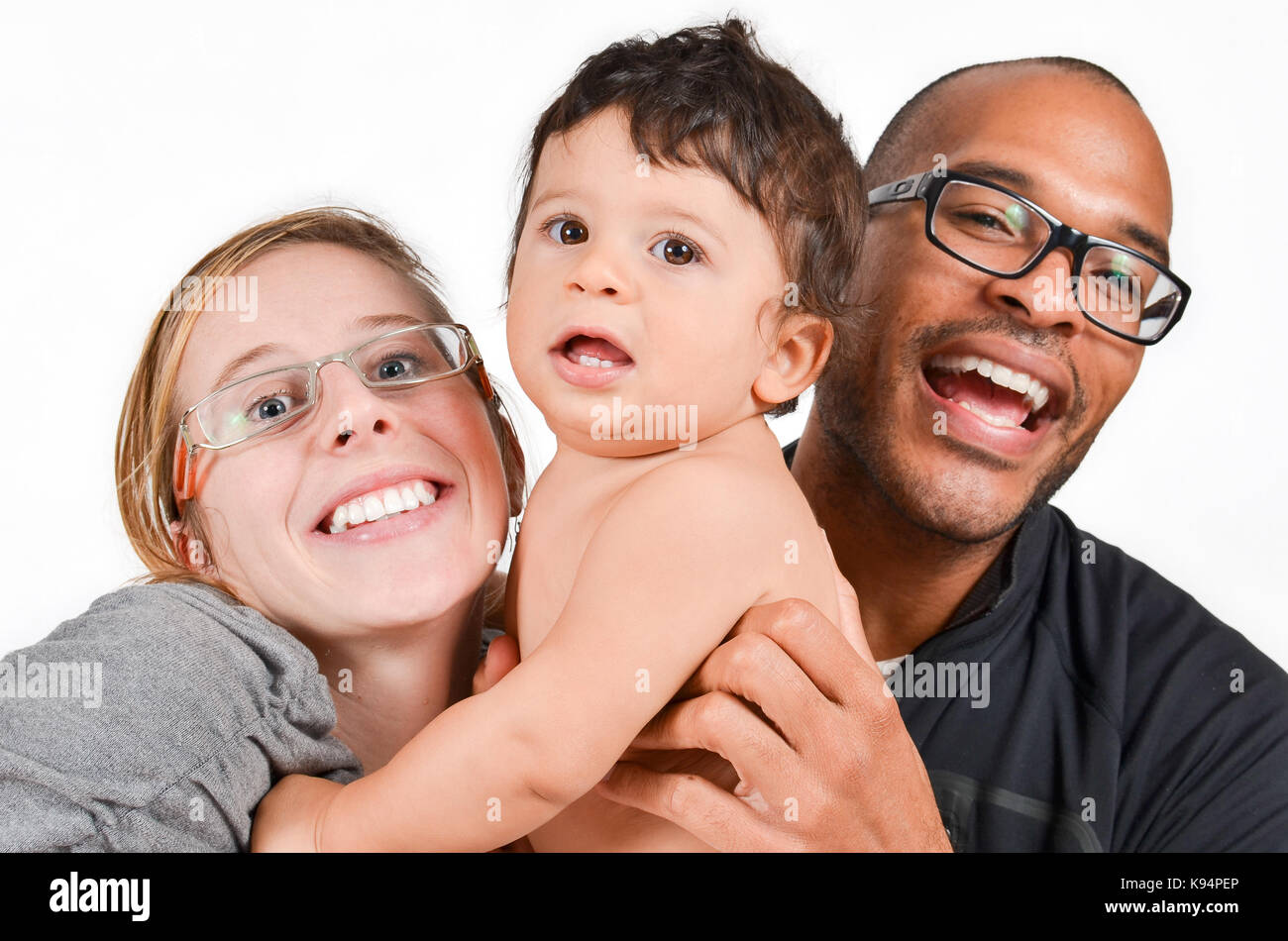 Happy interracial family is laughing Stock Photo - Alamy