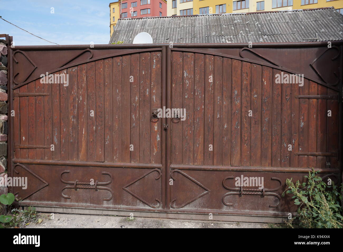 Wooden gates with stone columns. The design is vintage style Stock ...