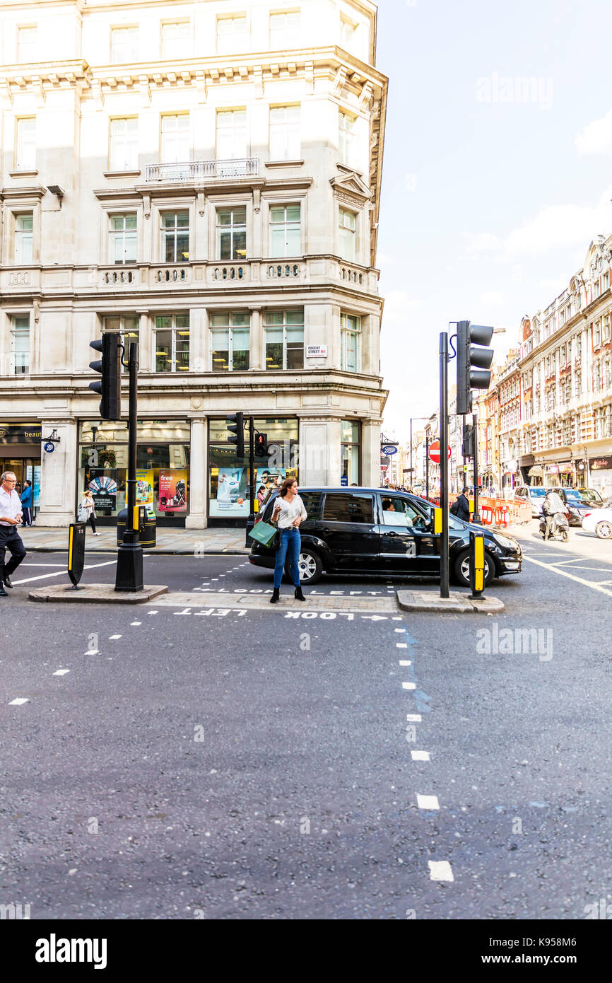 Crossing road in London, Crossing road with shopping bags, carrying ...