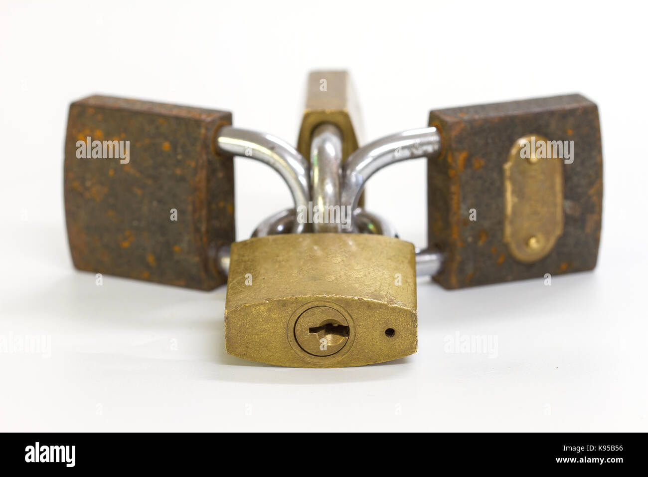 Close up on locked padlock over white background concept Stock Photo ...