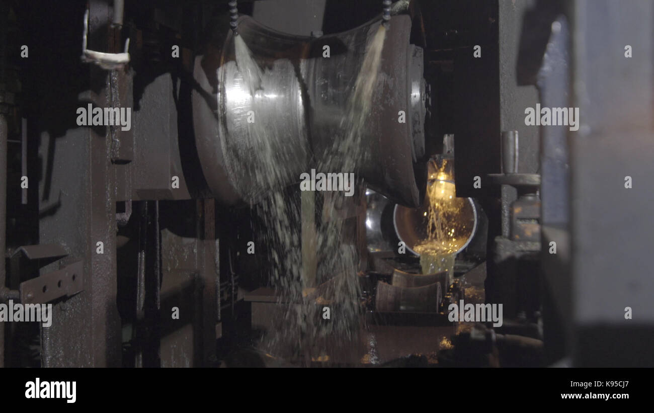 Tube rolling process at manufacturing plant. Closeup of production ...