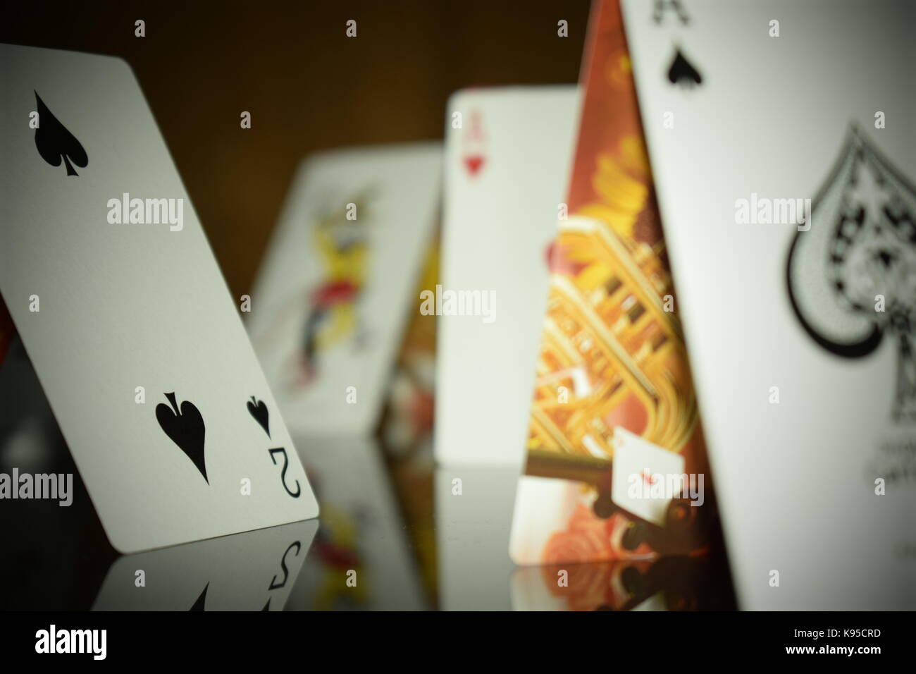 Playing cards are typically palm-sized for convenient handling, and ...