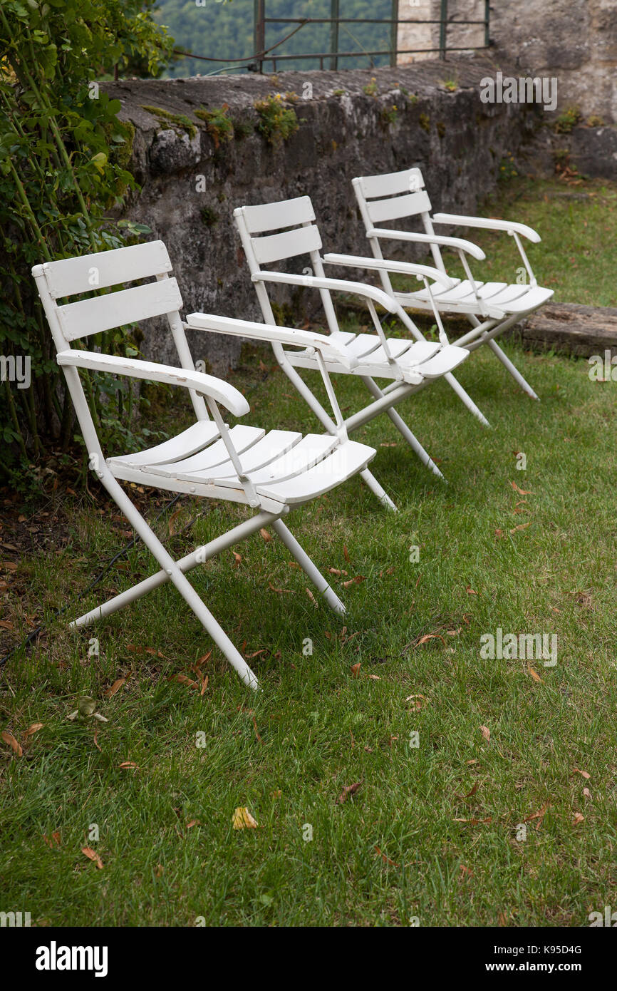 Outdoor collapsible wooden chairs Stock Photo - Alamy