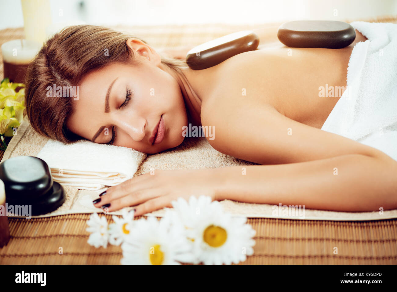 Young Beautiful Woman Relaxing At Spa Centre She Is Enjoying At Stone