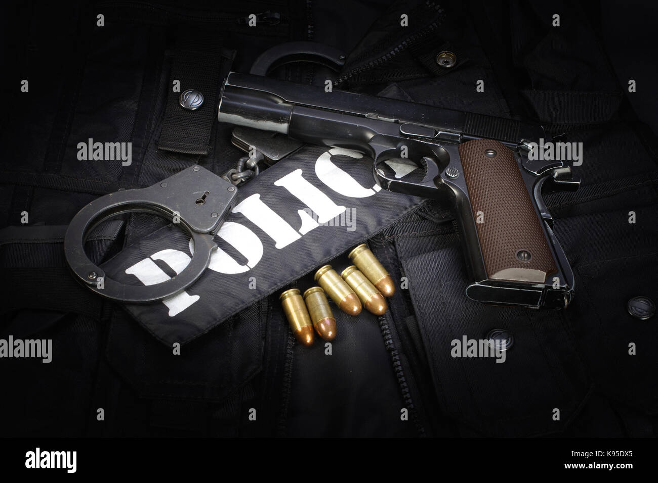 Police equipment on black background Stock Photo - Alamy