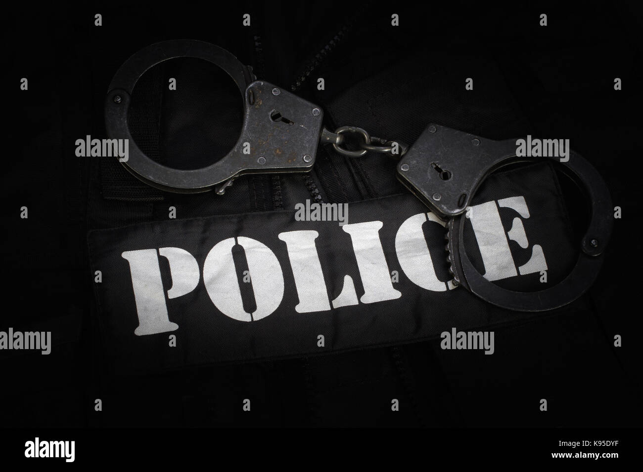 Police equipment on black background Stock Photo - Alamy