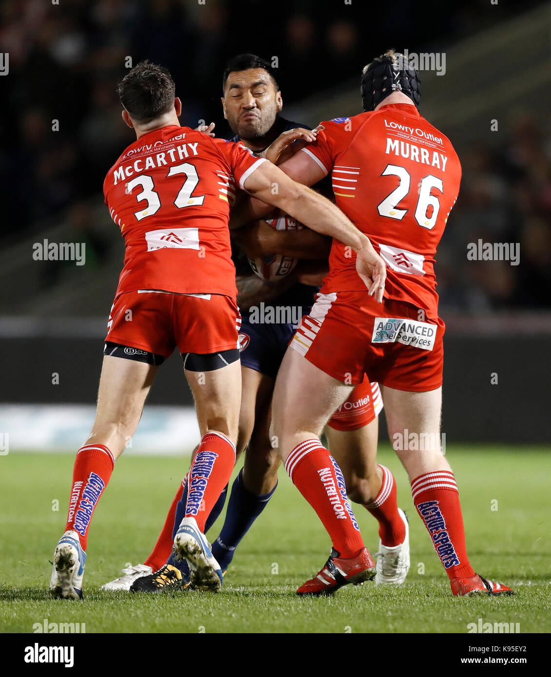 St Helens Zeb Taia is tackled by Salford Red Devils' Tyrone MCarthy and ...