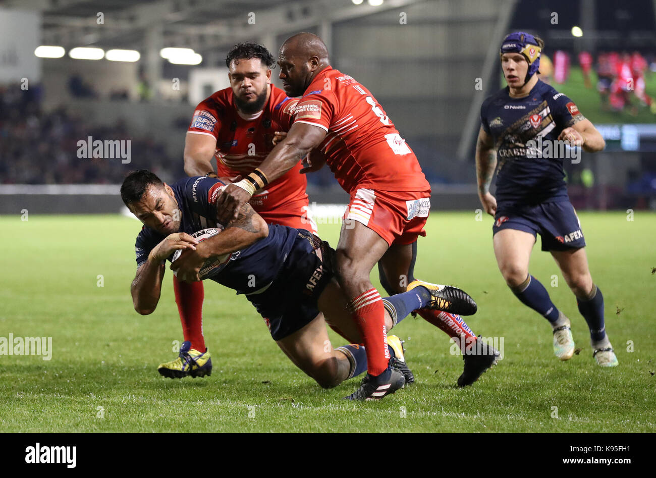 St Helens Zeb Taia goes over for a try past Salford Red Devils' Ben ...