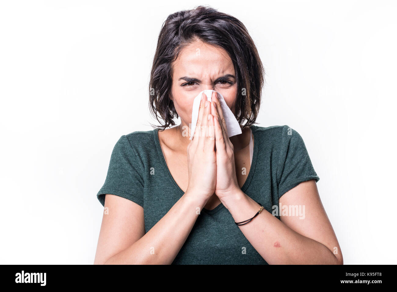 sneeze girl having flu on white studo background Stock Photo - Alamy