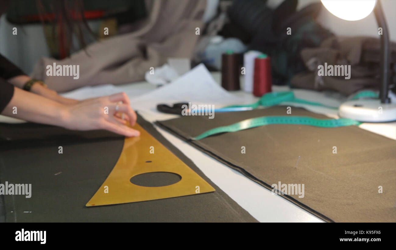 Tailors hands sewing dress hi-res stock photography and images - Alamy