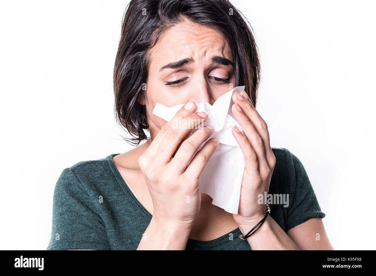 sneeze girl having flu on white studo background Stock Photo - Alamy
