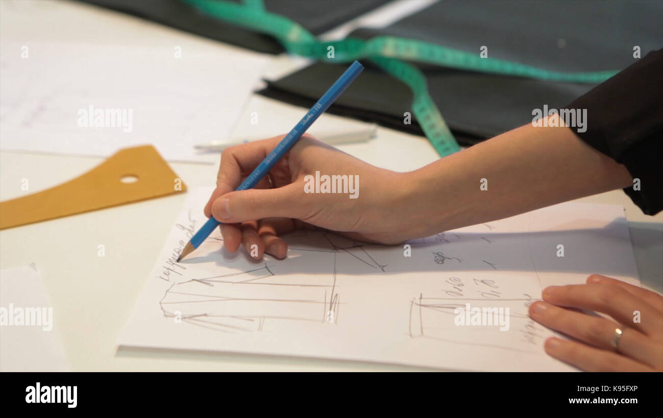 Tailor.Hands notch tailor tailor's scissors cloth. Female tailor ...