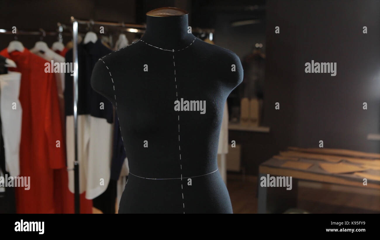 Empty black mannequin in the background light is in the middle of the ...