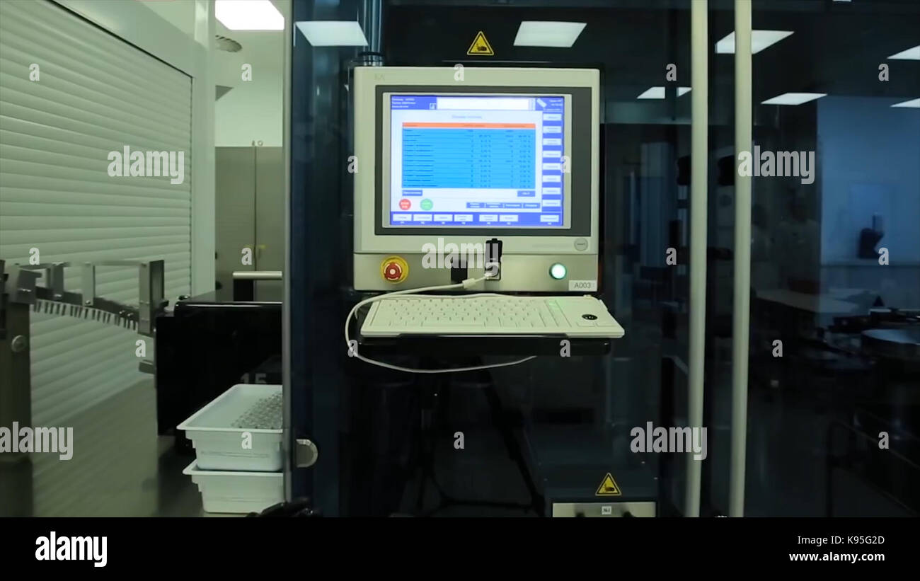 Computer in laboratory or manufactory. Biochemical analyzer and ...