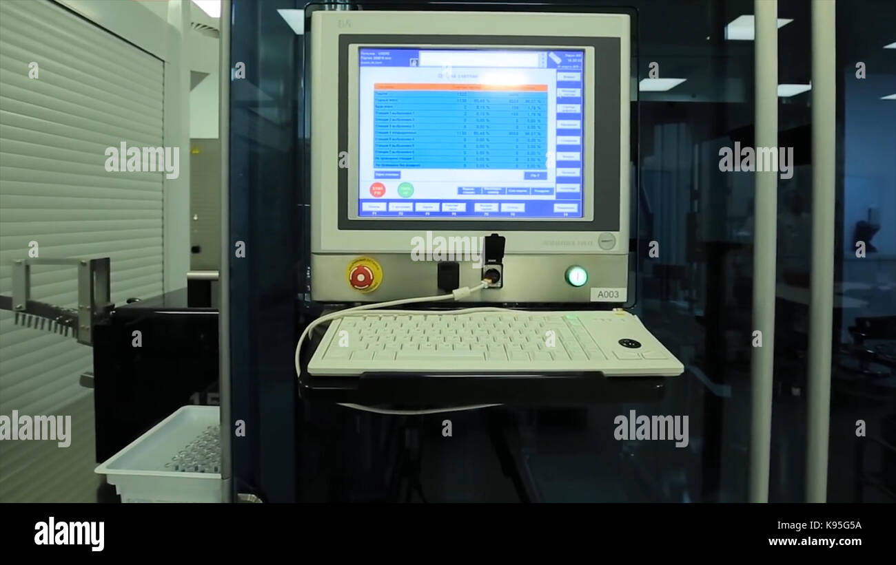 Computer in laboratory or manufactory. Biochemical analyzer and ...