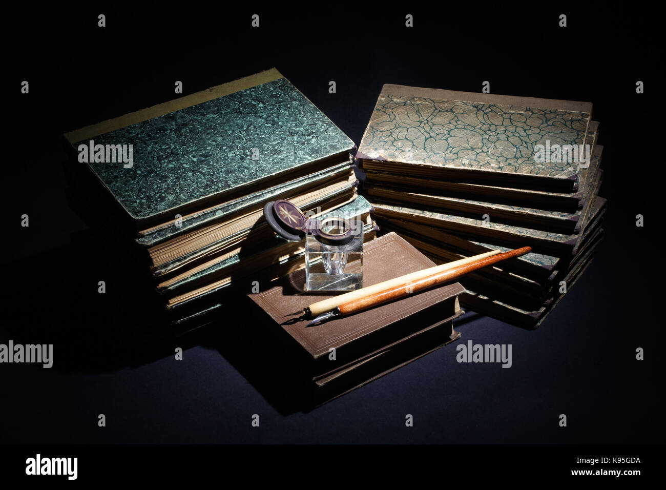 old books, papers, ink pen and inkpot on black background Stock Photo ...