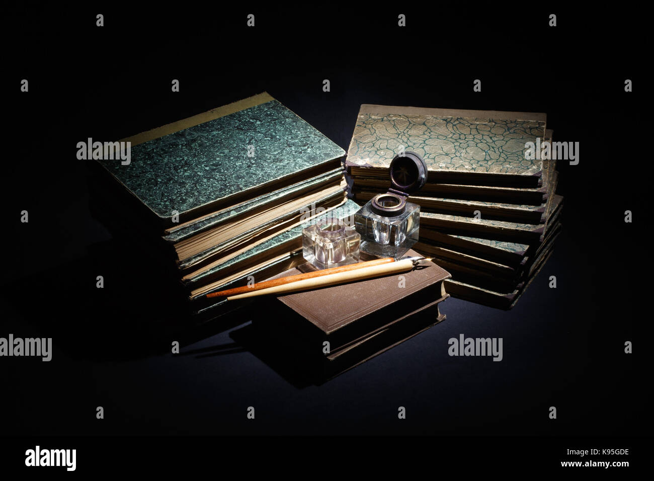 old books, papers, ink pen and inkpot on black background Stock Photo ...