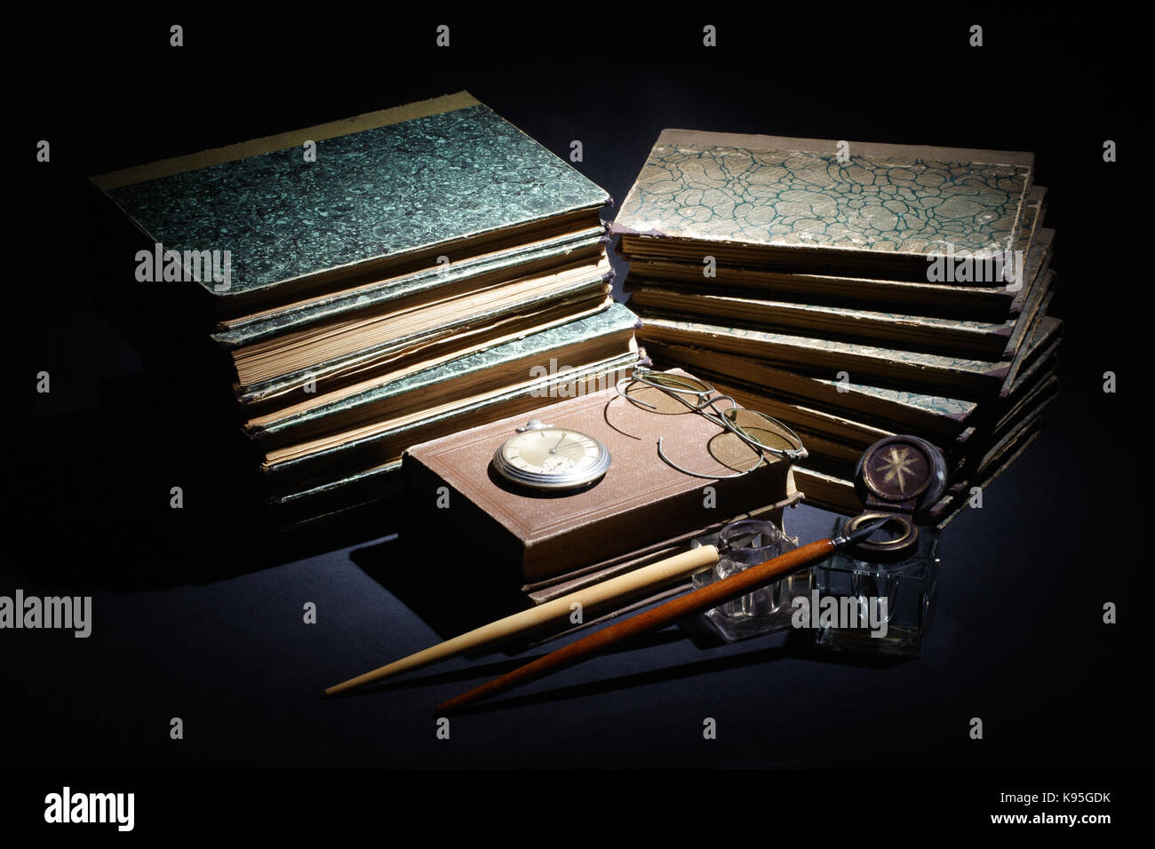 old books, papers, ink pen and inkpot on black background Stock Photo ...