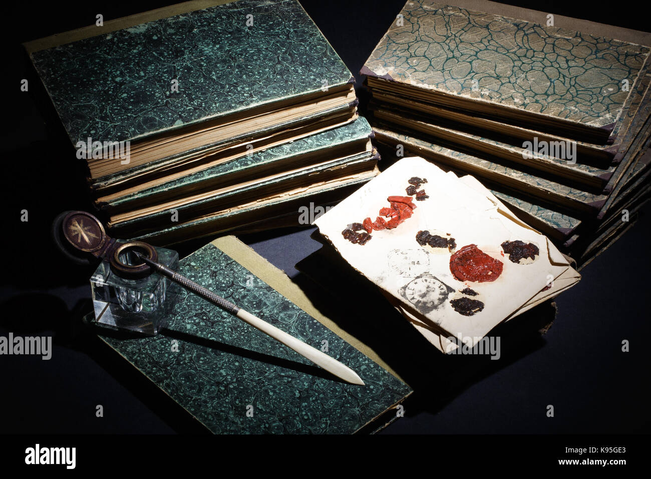 old books, papers, ink pen and inkpot on black background Stock Photo ...