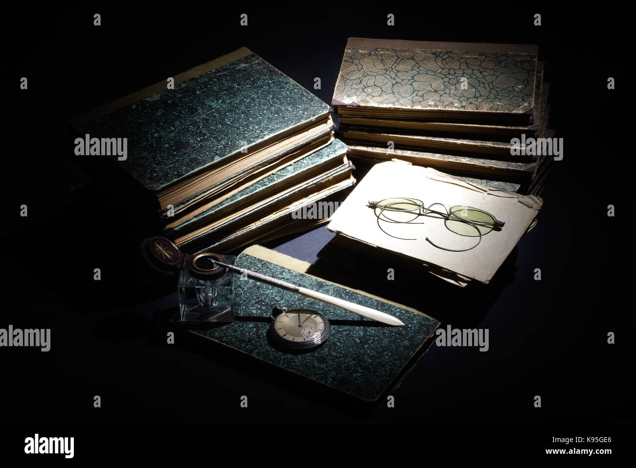 old books, papers, ink pen and inkpot on black background Stock Photo ...