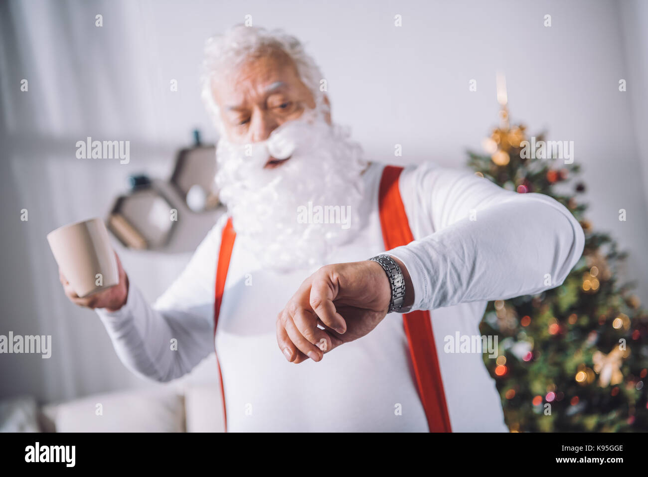 santa claus checking time Stock Photo - Alamy