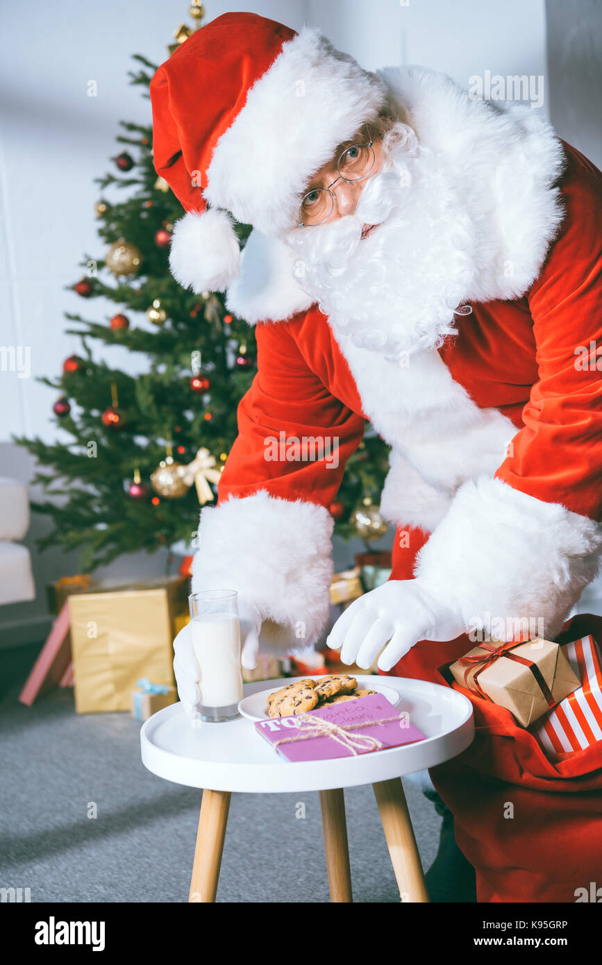 santa claus stealing cookies Stock Photo - Alamy