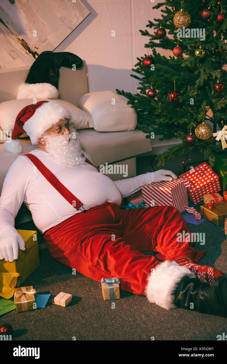 santa claus lying on floor Stock Photo - Alamy