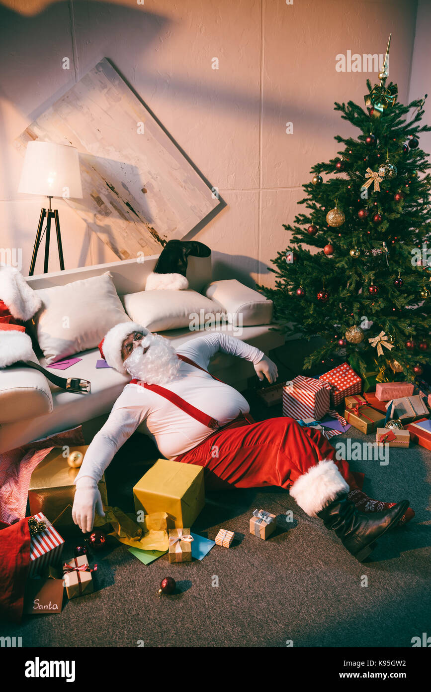 santa claus lying on floor Stock Photo - Alamy