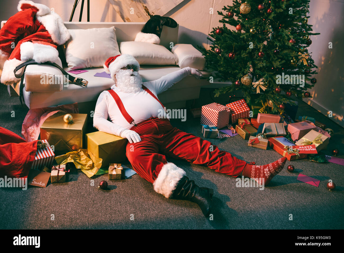 santa claus lying on floor Stock Photo - Alamy