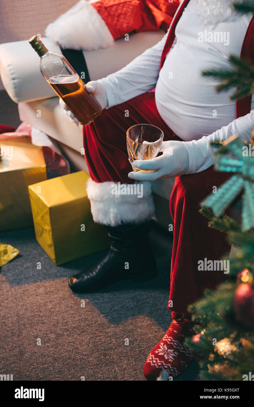 bad santa with alcohol Stock Photo - Alamy