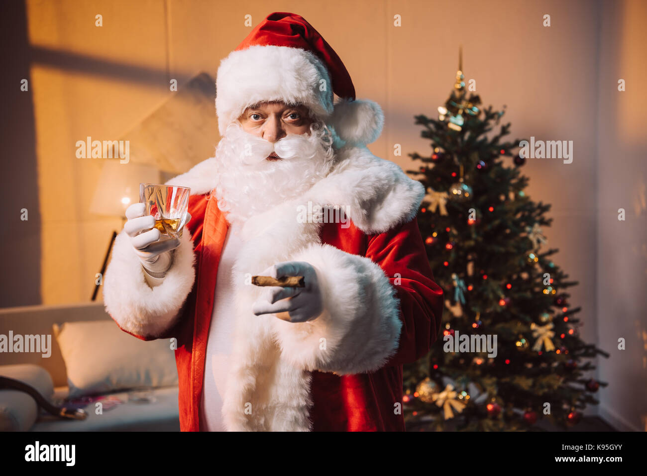 santa claus with glass of whiskey and cigar Stock Photo - Alamy