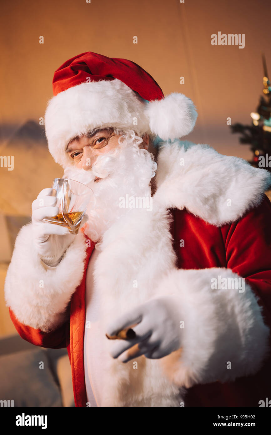 santa claus with glass of whiskey and cigar Stock Photo - Alamy