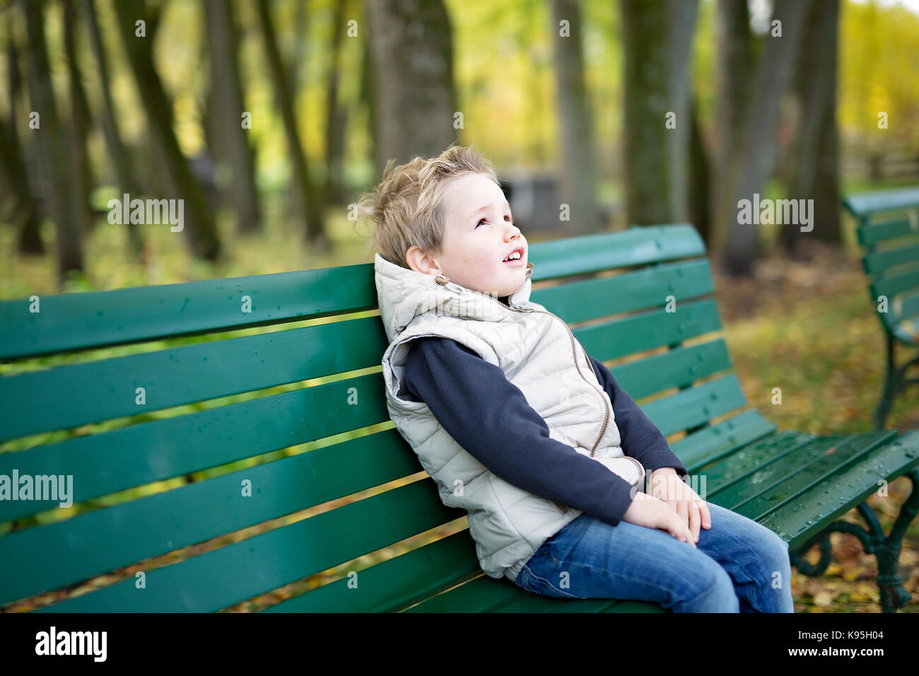 boy in autumn season in a park Stock Photo - Alamy